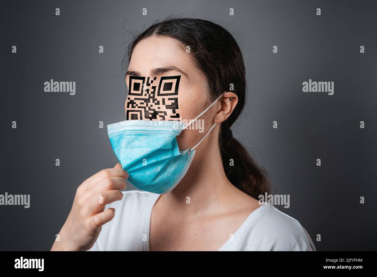 Portrait of a woman with a QR code instead of eyes and nose. Dark ...
