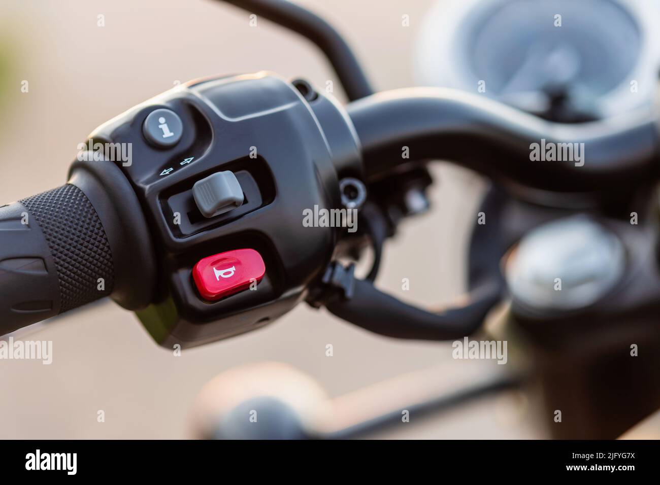 Red horn switch. Macro left handle bar with hand clutch of motorcycle ...