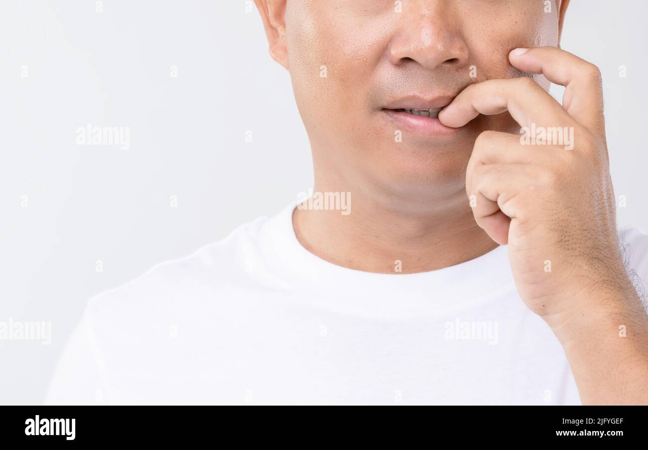 Nail Biting (Onychophagia) concept : Portrait people biting his nail ...
