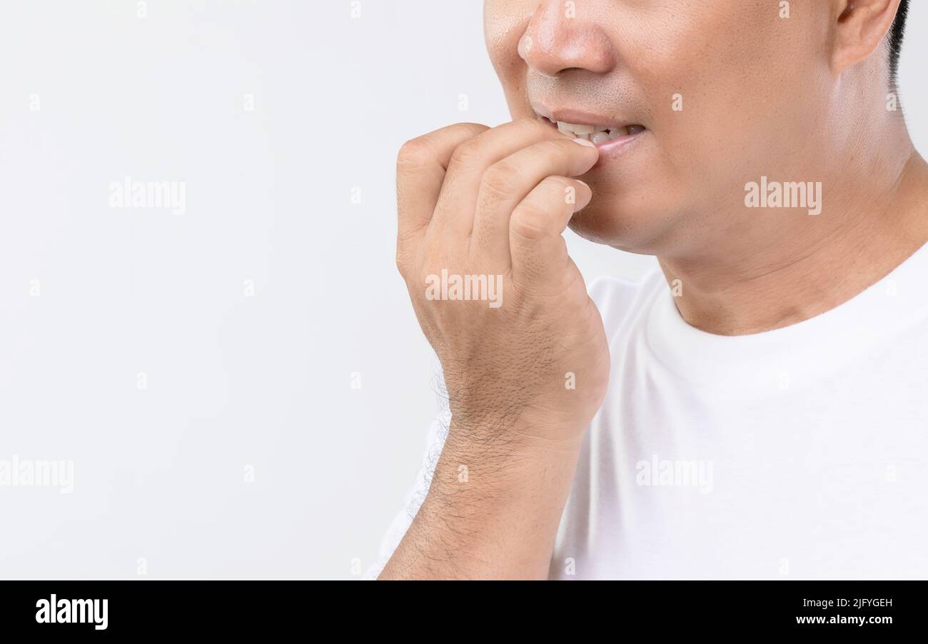Nail Biting (Onychophagia) concept : Portrait people biting his nail ...