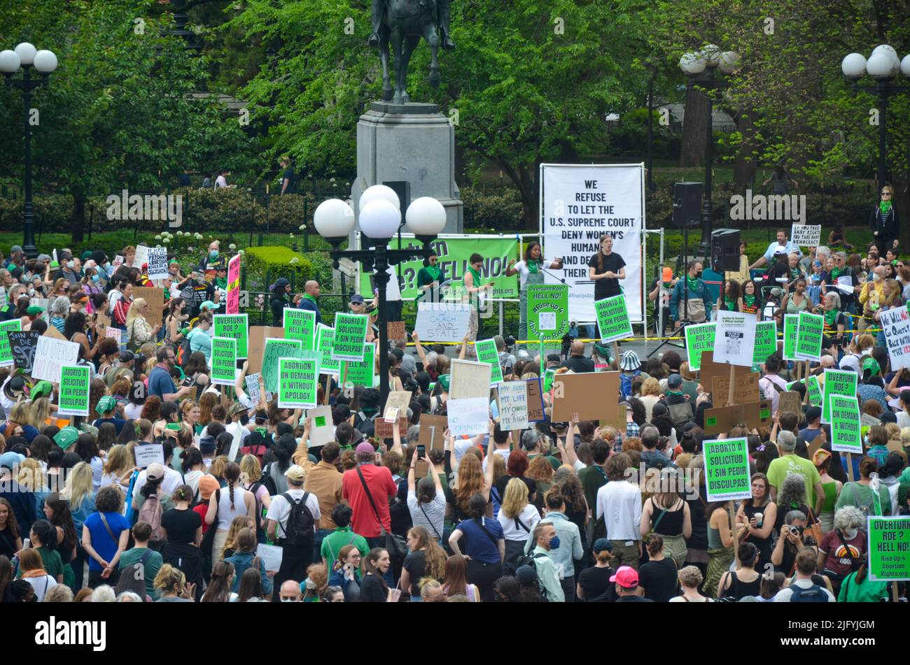 A crowd of protesters holding cardboard signs after Supreme Court ...