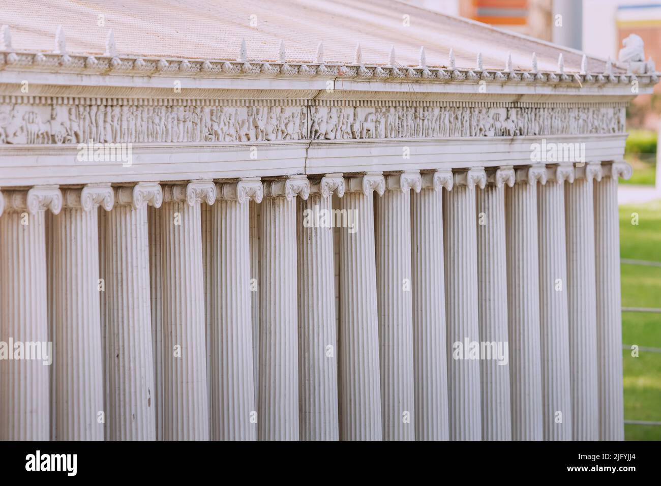 A smooth and rhythmic row of classical Greek columns in the ancient ...