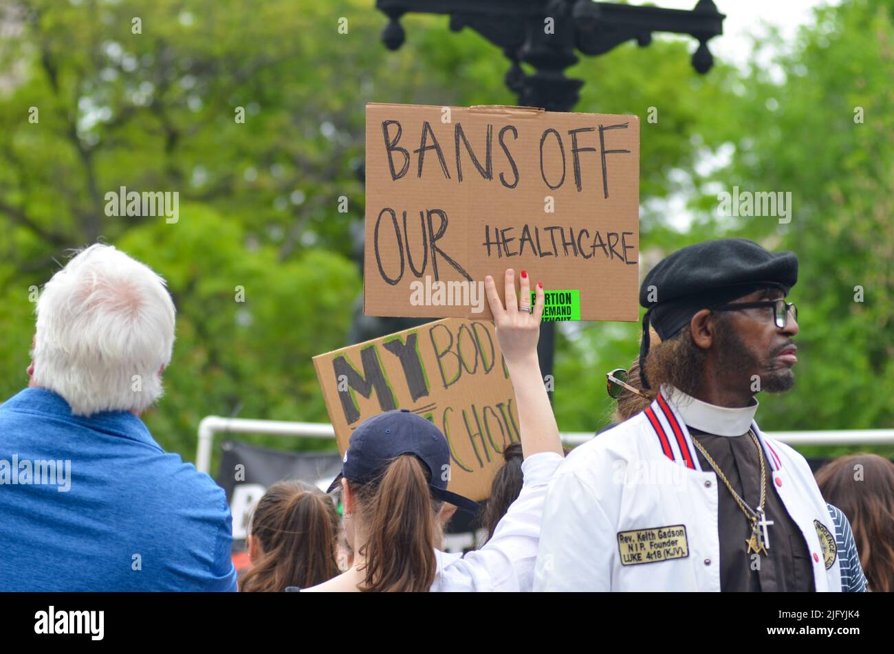 A crowd of protesters holding cardboard signs after Supreme Court ...