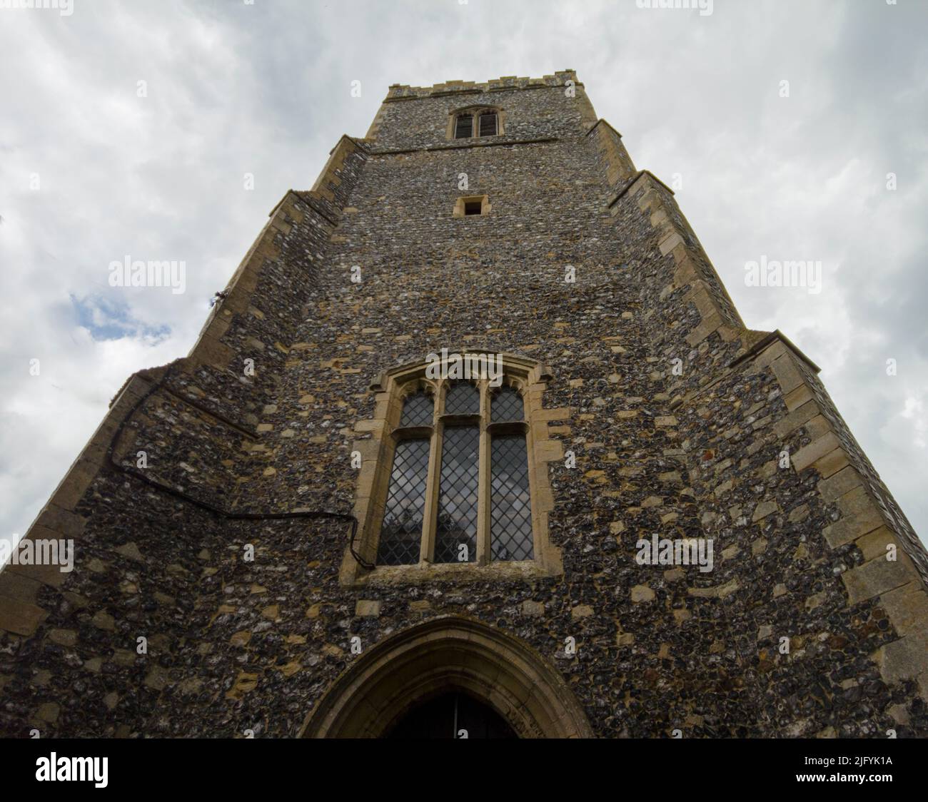 A low angle shot of St Botolph's Church tower in Iken, England in ...