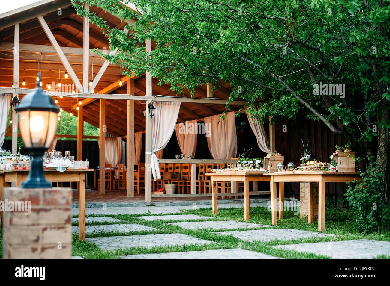 Delicious catering banquet buffet table decorated in rustic style in ...