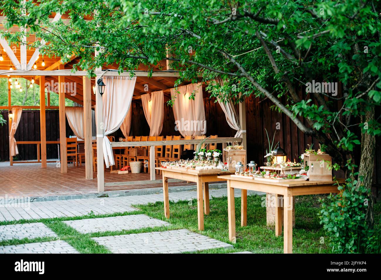 Delicious catering banquet buffet table decorated in rustic style in ...