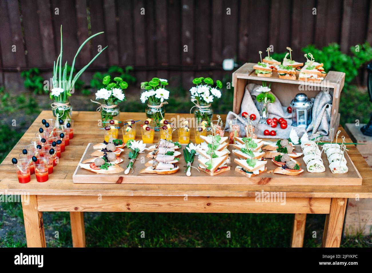 Delicious catering banquet buffet table decorated in rustic style in ...