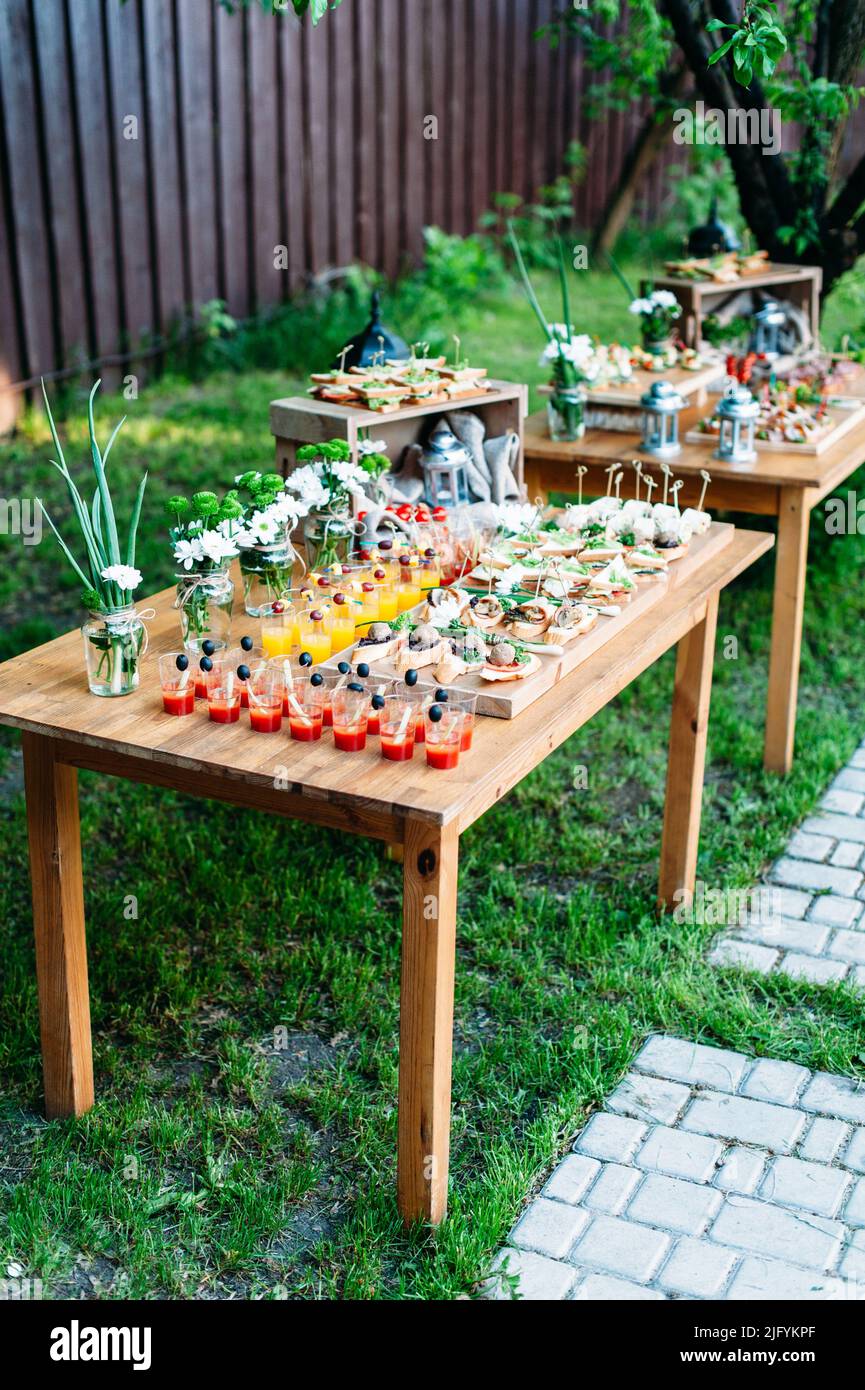 Beautiful catering banquet buffet table decorated in rustic style in ...