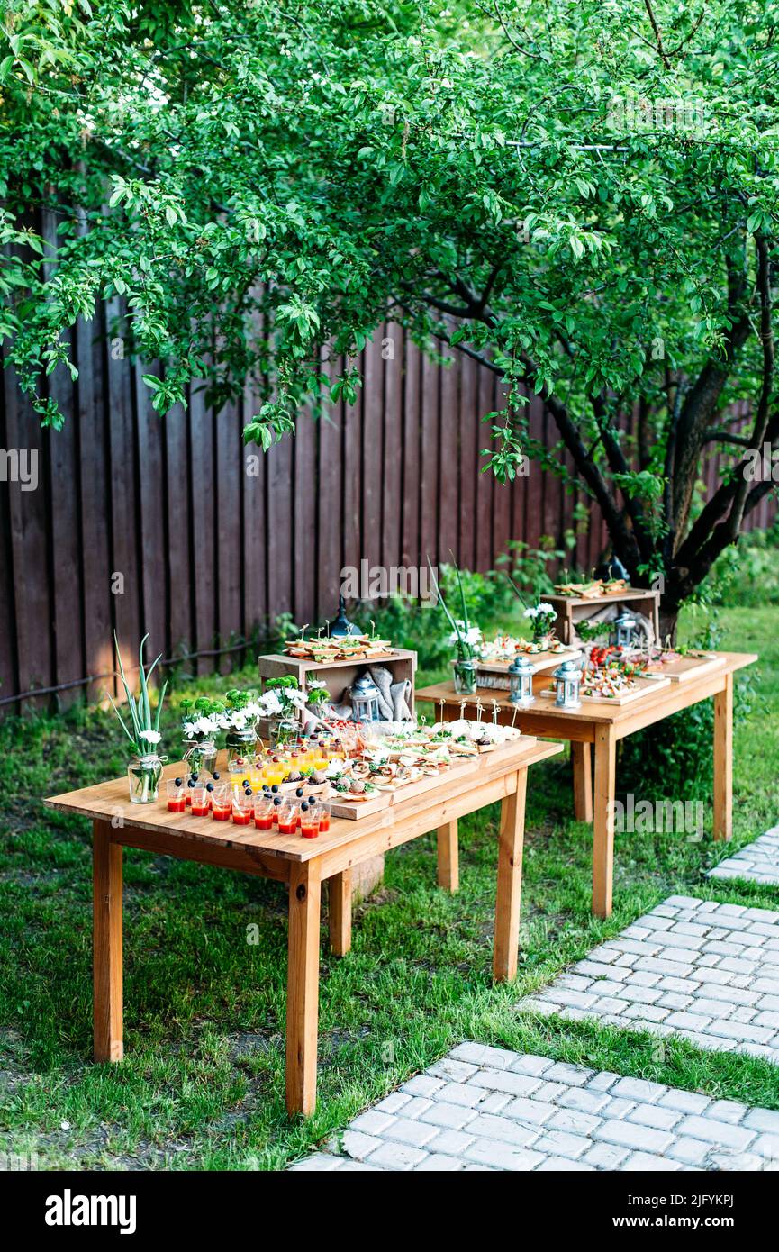 Beautiful catering banquet buffet table decorated in rustic style in ...