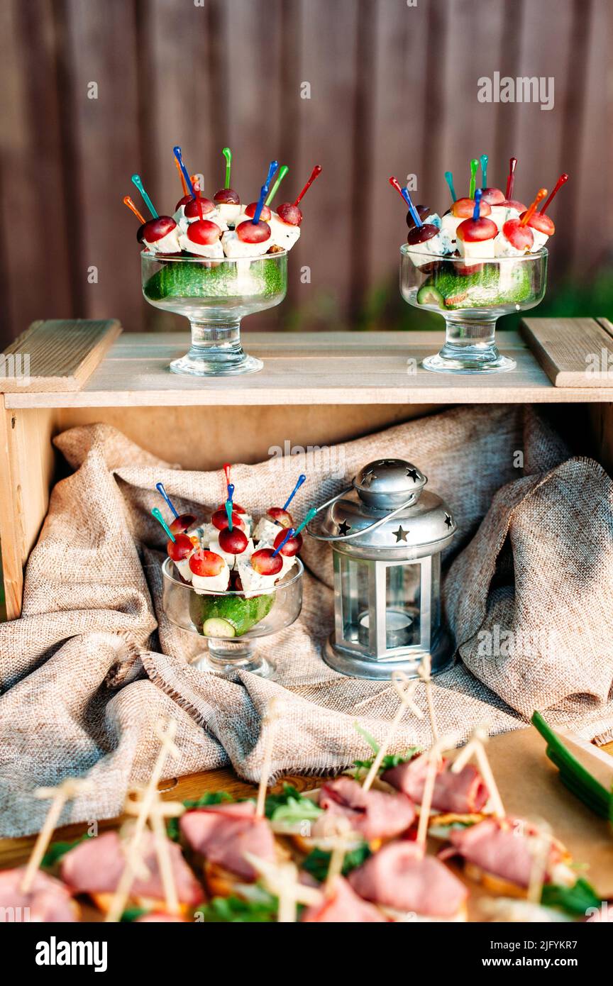 Delicious catering banquet buffet table decorated in rustic style in ...