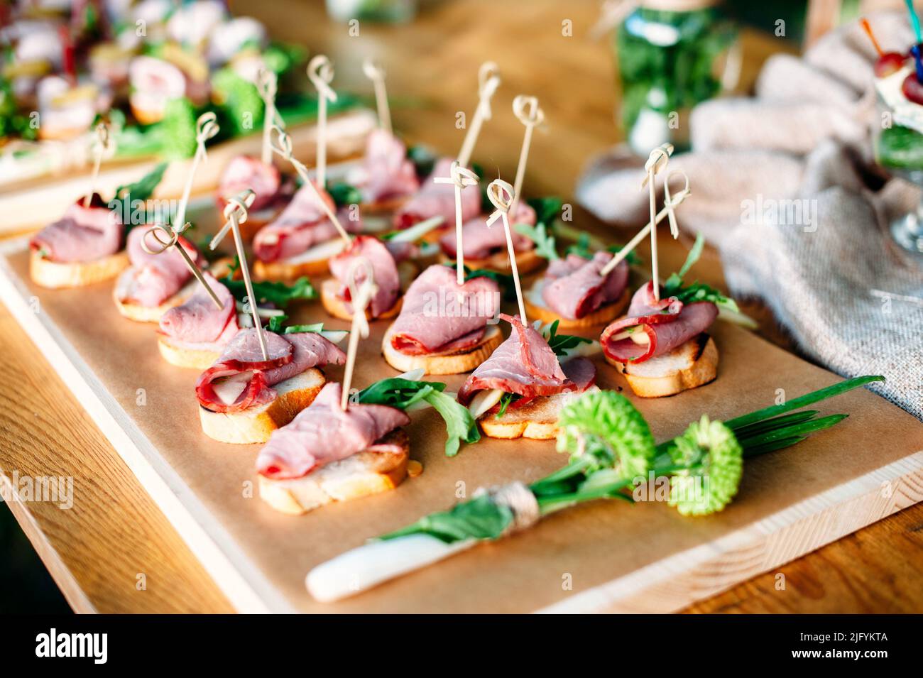 Delicious catering banquet buffet table decorated in rustic style in ...