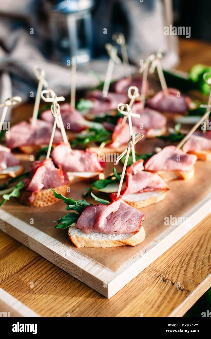 Delicious catering banquet buffet table decorated in rustic style in ...