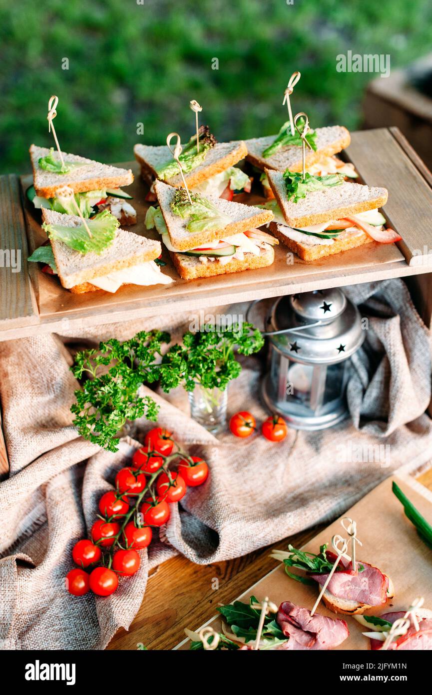 Delicious catering banquet buffet table decorated in rustic style in ...