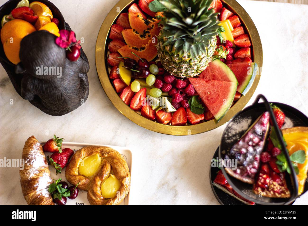 A top view of watermelon, strawberries, cherries, grapes, raspberries ...