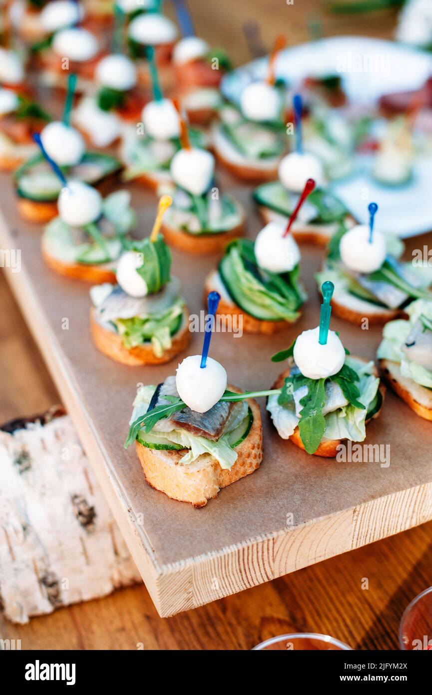 Delicious catering banquet buffet table decorated in rustic style in ...