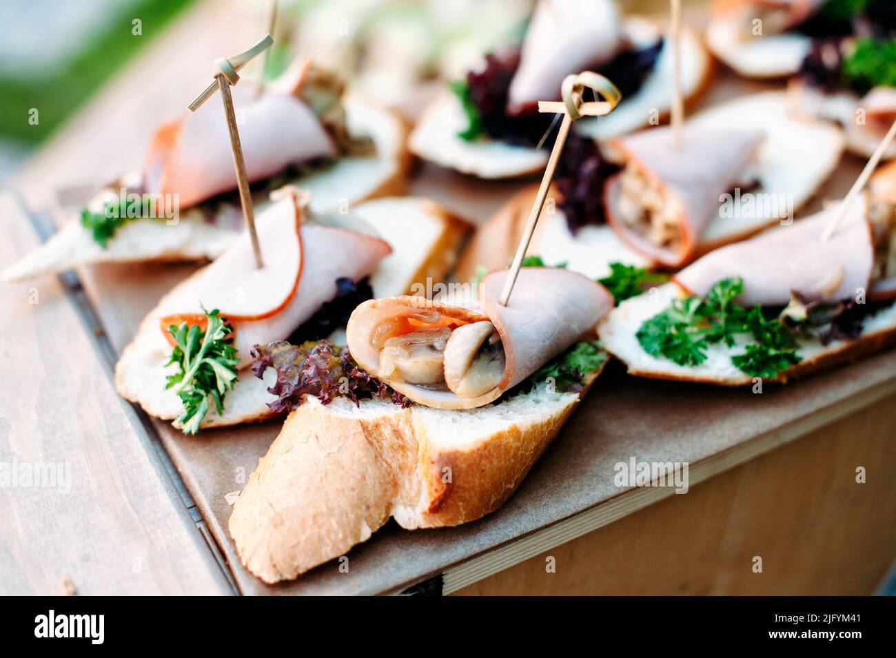 Delicious catering banquet buffet table decorated in rustic style in ...
