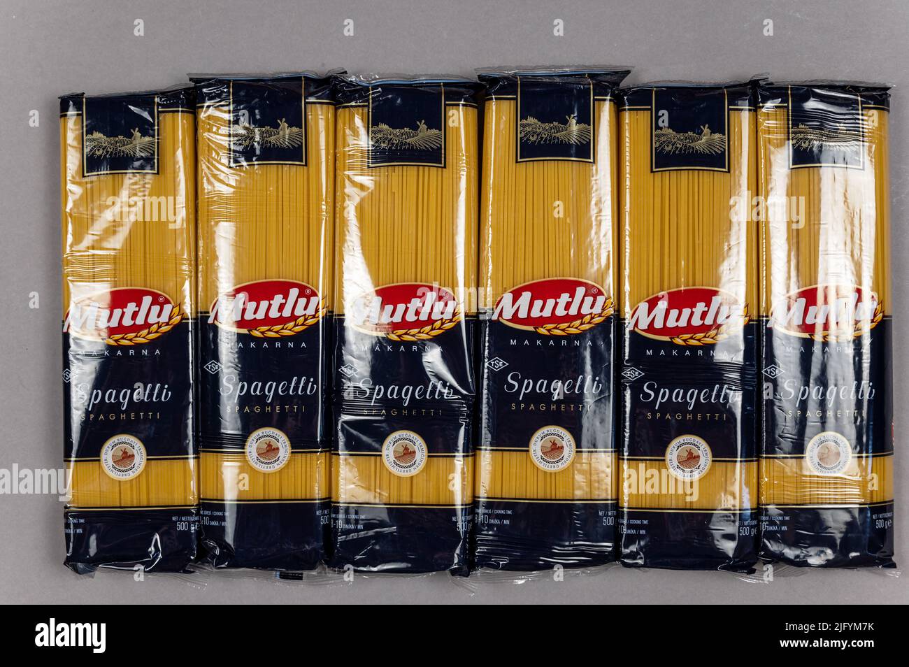 Six packs of spaghetti on gray. Products of the largest Turkish brand ...