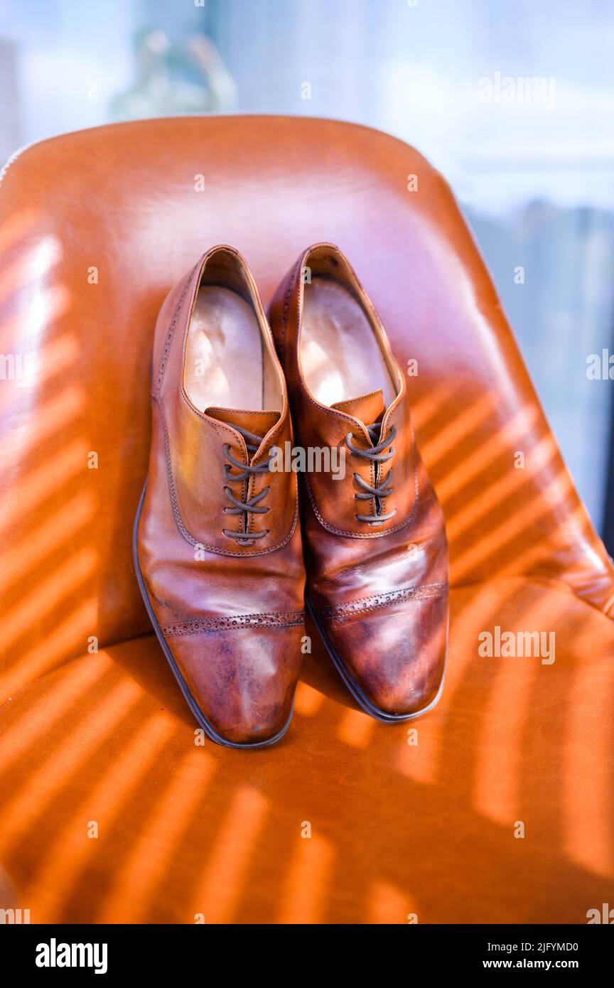 Stylish men shoes on chair Stock Photo - Alamy