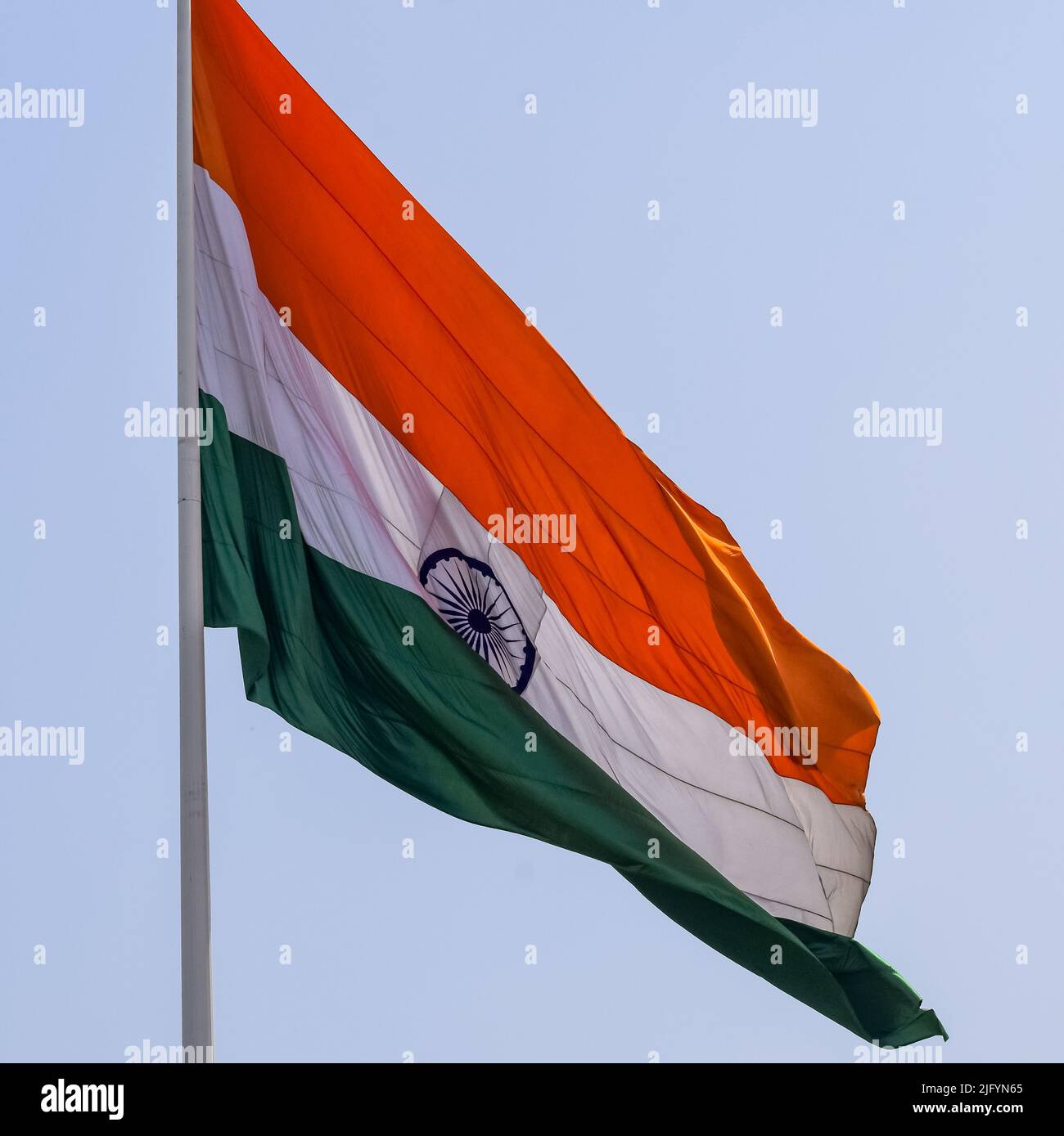 India flag flying high at Connaught Place with pride in blue sky, India ...