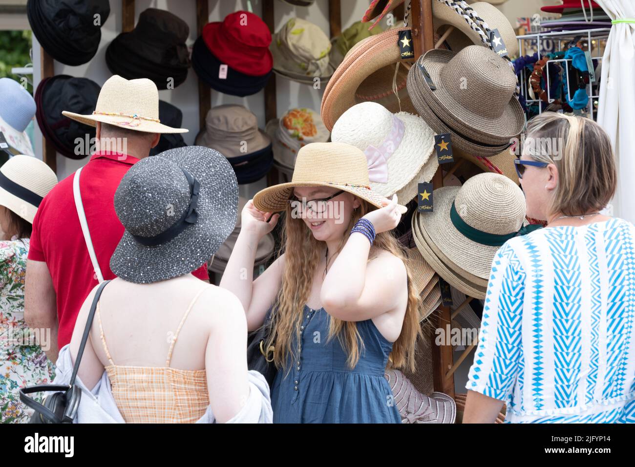 People try on hats at the RHS Hampton Court Flower Festival Stock Photo ...