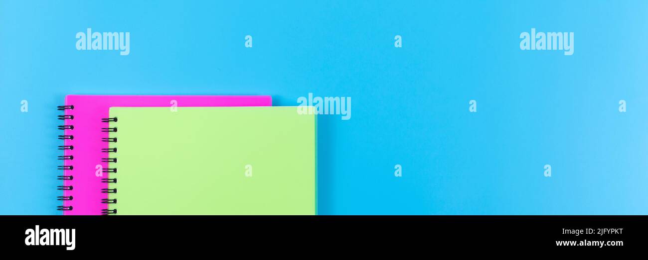 Education banner for website with two spiral notebooks on bright blue ...