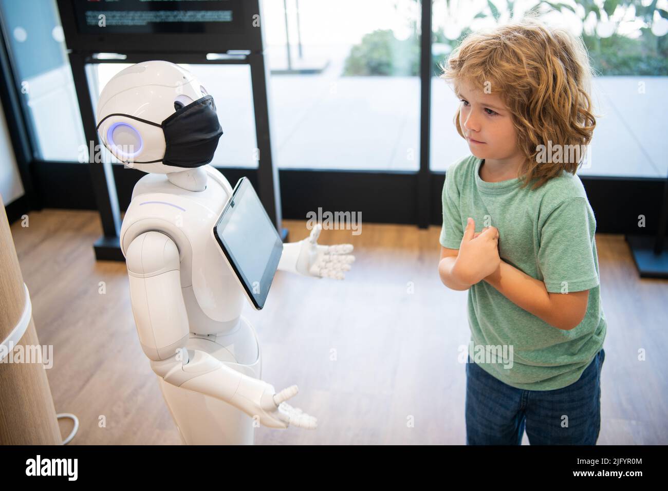 little boy interact with robot artificial intelligence, future tech ...