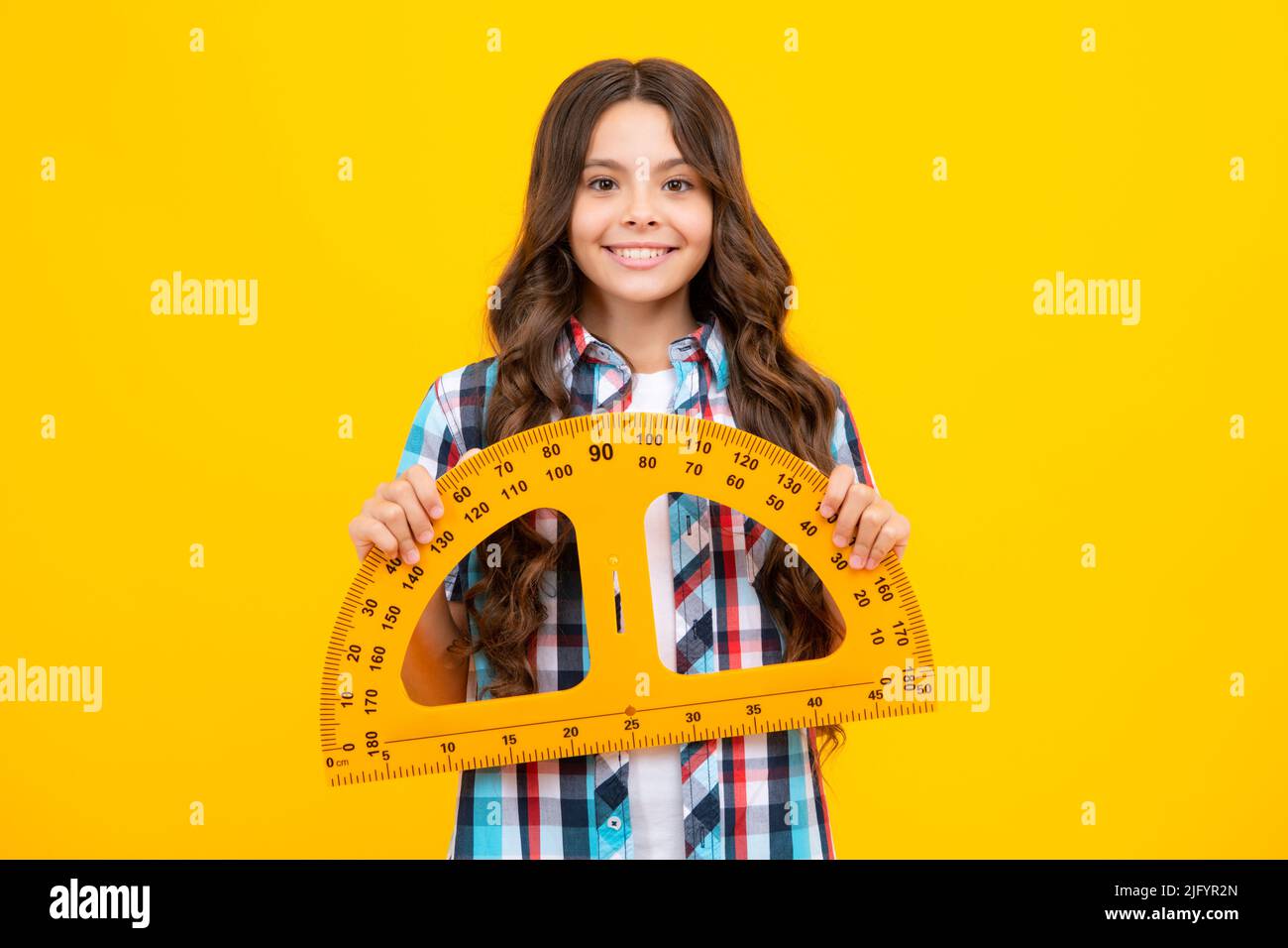 Schoolgirl in school uniform hold mathematics measure. Metric ...