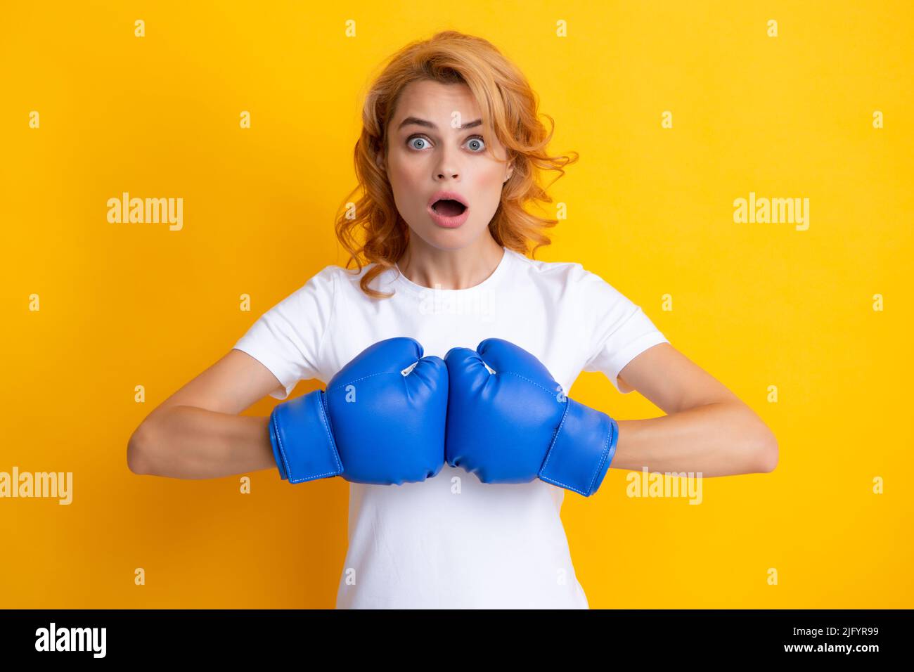 Surprised female boxer. Woman in boxing gloves Stock Photo - Alamy