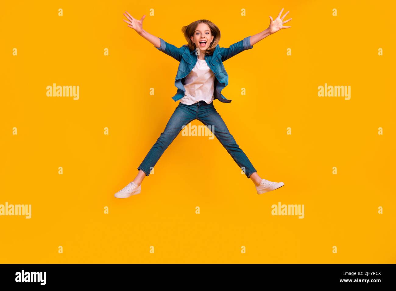 Full body photo of overjoyed satisfied person jumping raise opened arms ...
