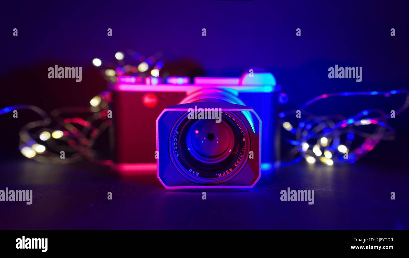 A closeup of the camera illuminated with pink and blue lights Stock ...