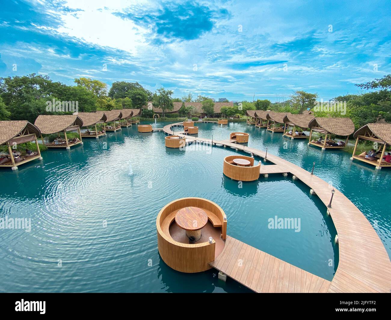 The beautiful outdoor restaurant with float cottages on the surface of ...