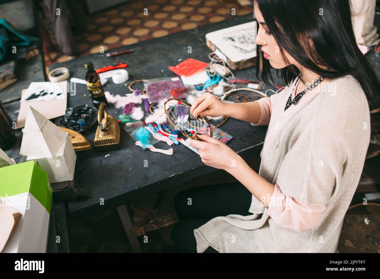 master makes new Dreamcatcher in art studio Stock Photo - Alamy
