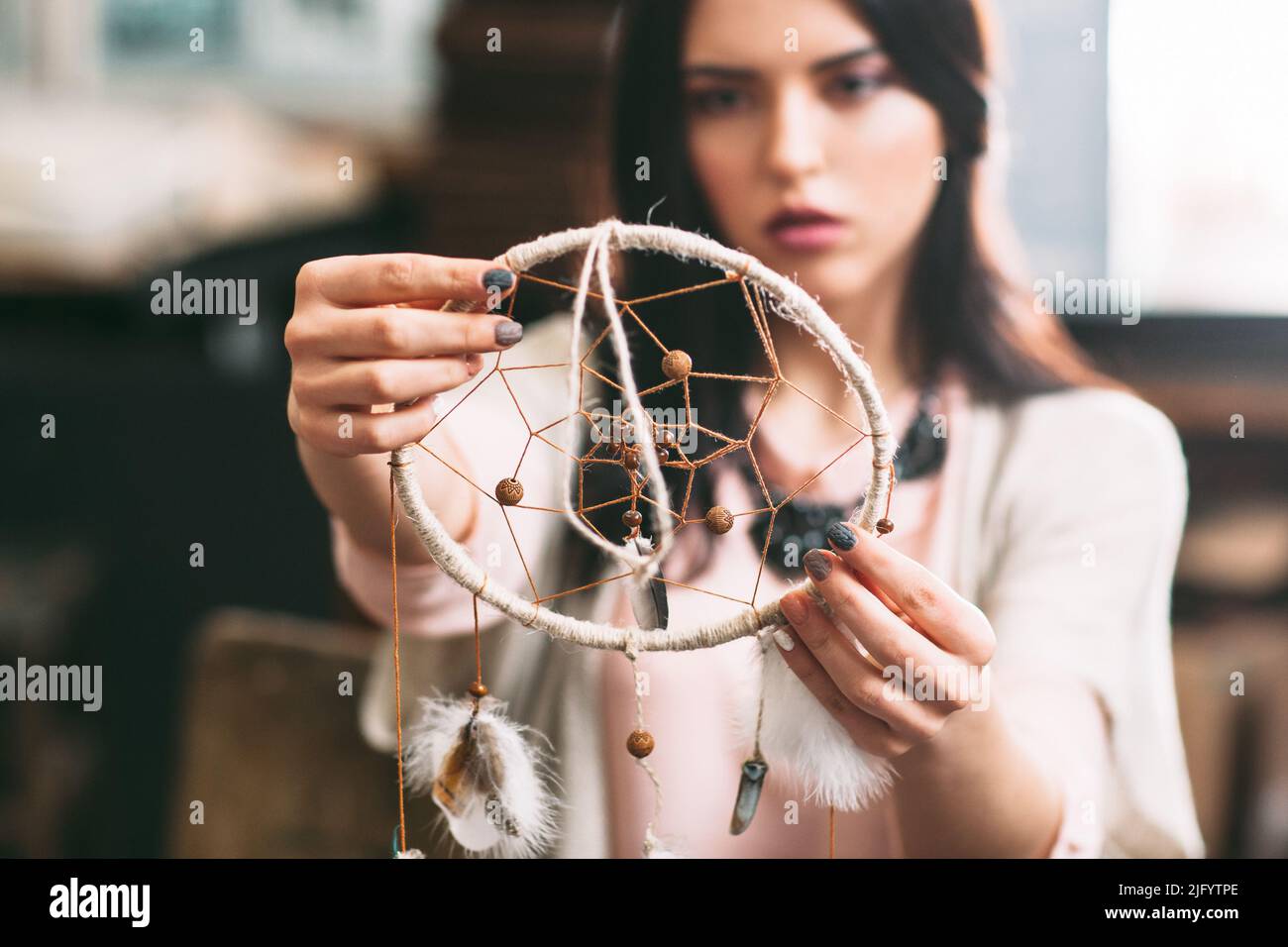 Master looks at the finished Dreamcatcher Stock Photo - Alamy