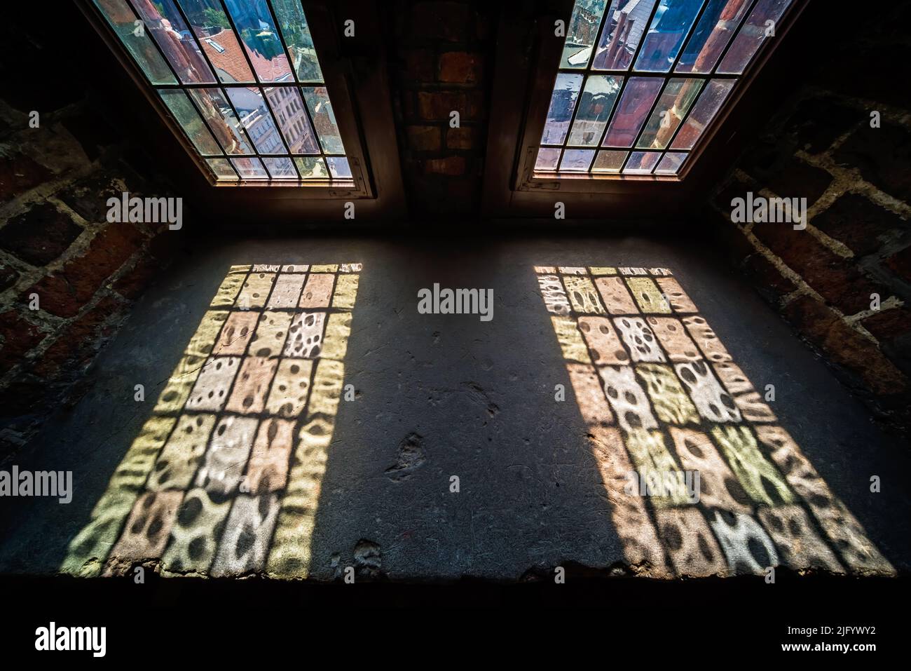 Colorful patterns of a light coming through the frosted stained window ...