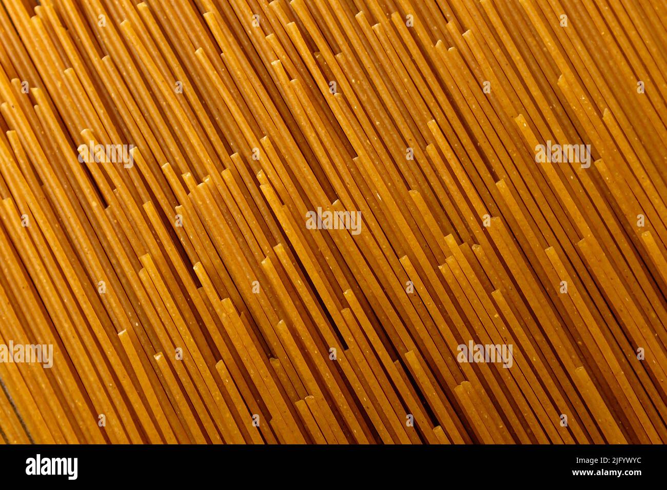 Whole wheat spaghetti, a type of pasta made from whole wheat Stock ...