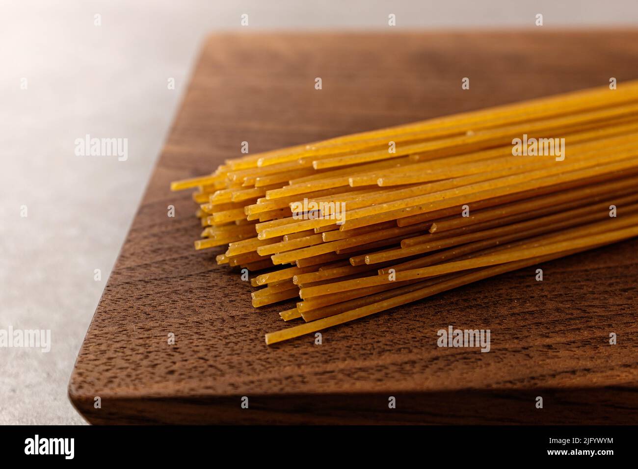 Whole wheat spaghetti, a type of pasta made from whole wheat Stock ...