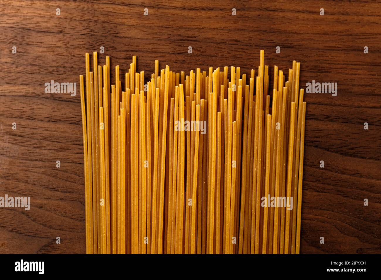 Whole wheat spaghetti, a type of pasta made from whole wheat Stock ...