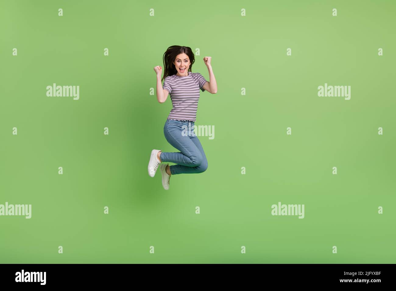 Full length body size view of attractive cheerful lucky girl jumping ...