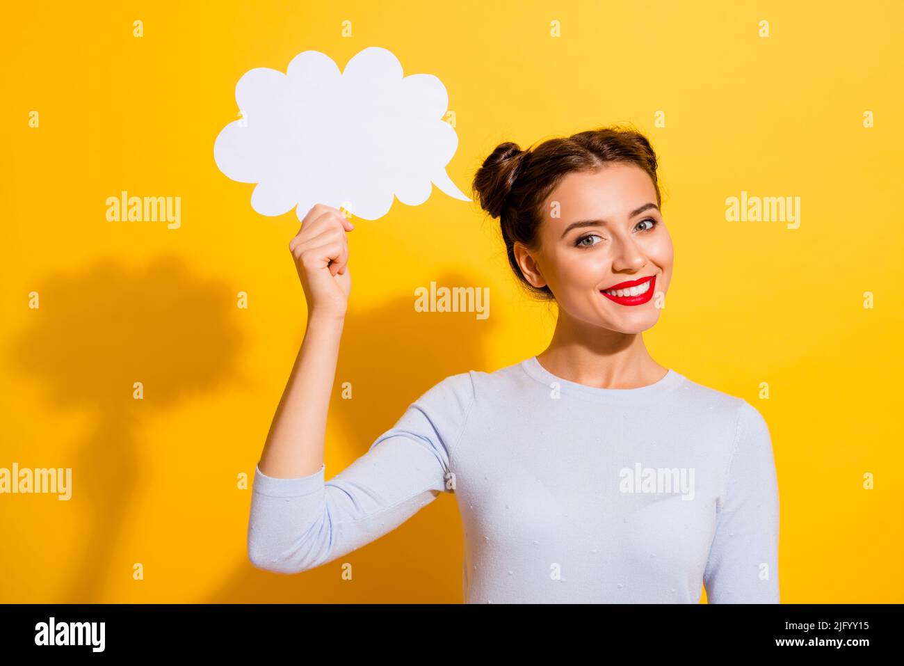 Photo of sweet shiny lady wear long sleeve holding mind cloud empty space isolated yellow color ...