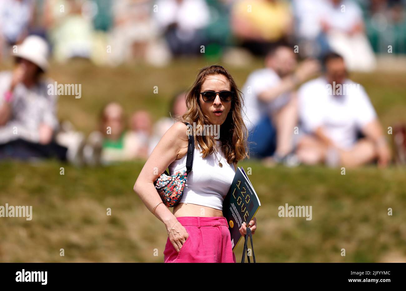 Spectators with an official match day programme on day ten of the 2022 ...
