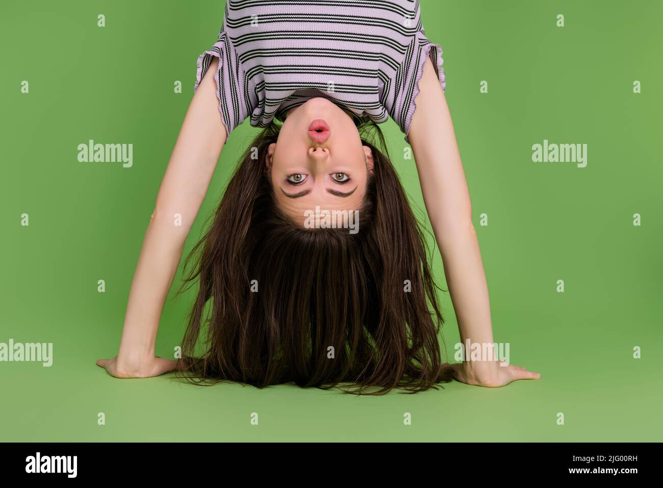 Upside down view portrait of attractive amazed girly funny girl ...