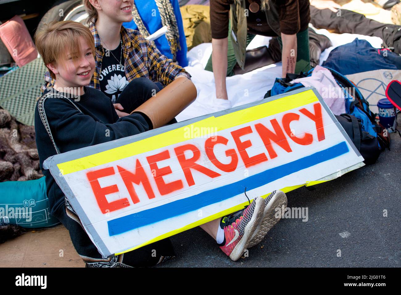 Climate change protesters with signs at the Extinction Rebellion ...