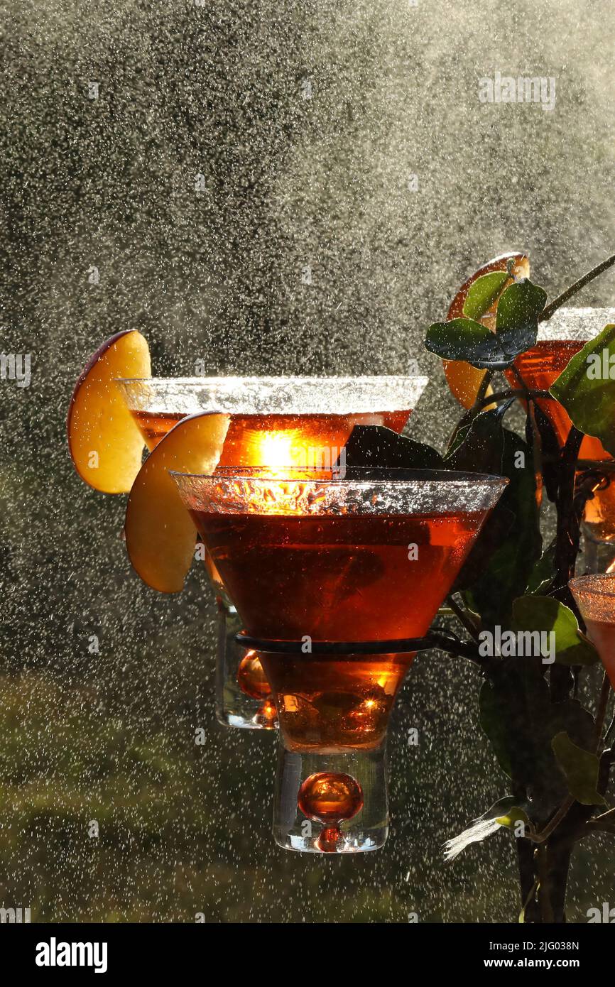 beautiful glasses with cold summer drink and fruits. cocktail in ...