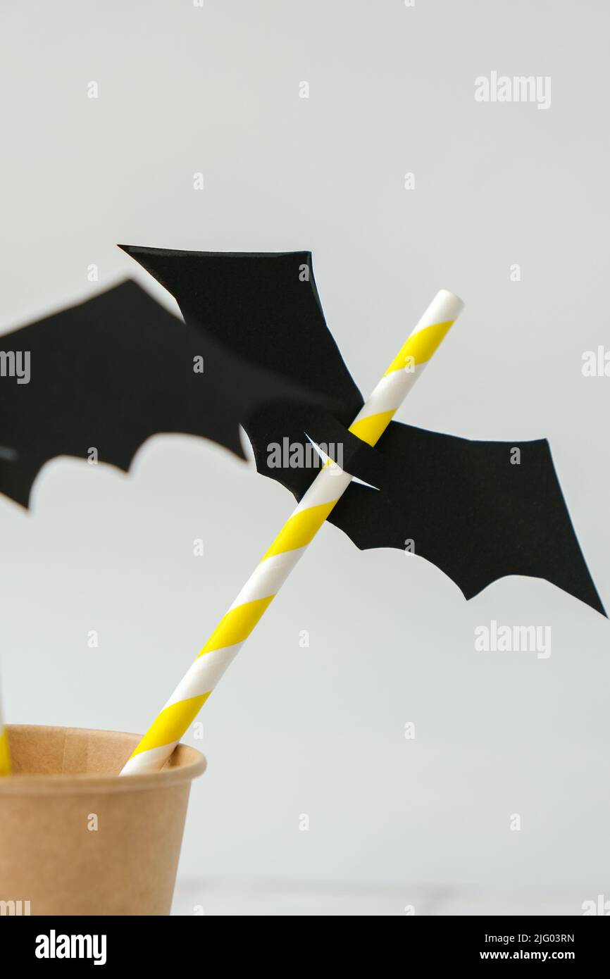 Black paper bat on drinking straw. Halloween party decoration. DIY for ...