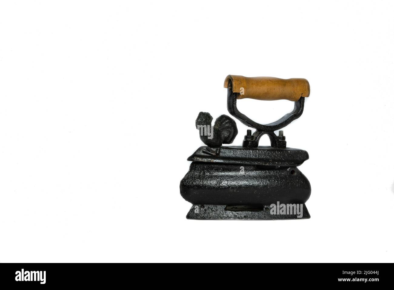 antique black iron steam with wooden handle isolated on white ...