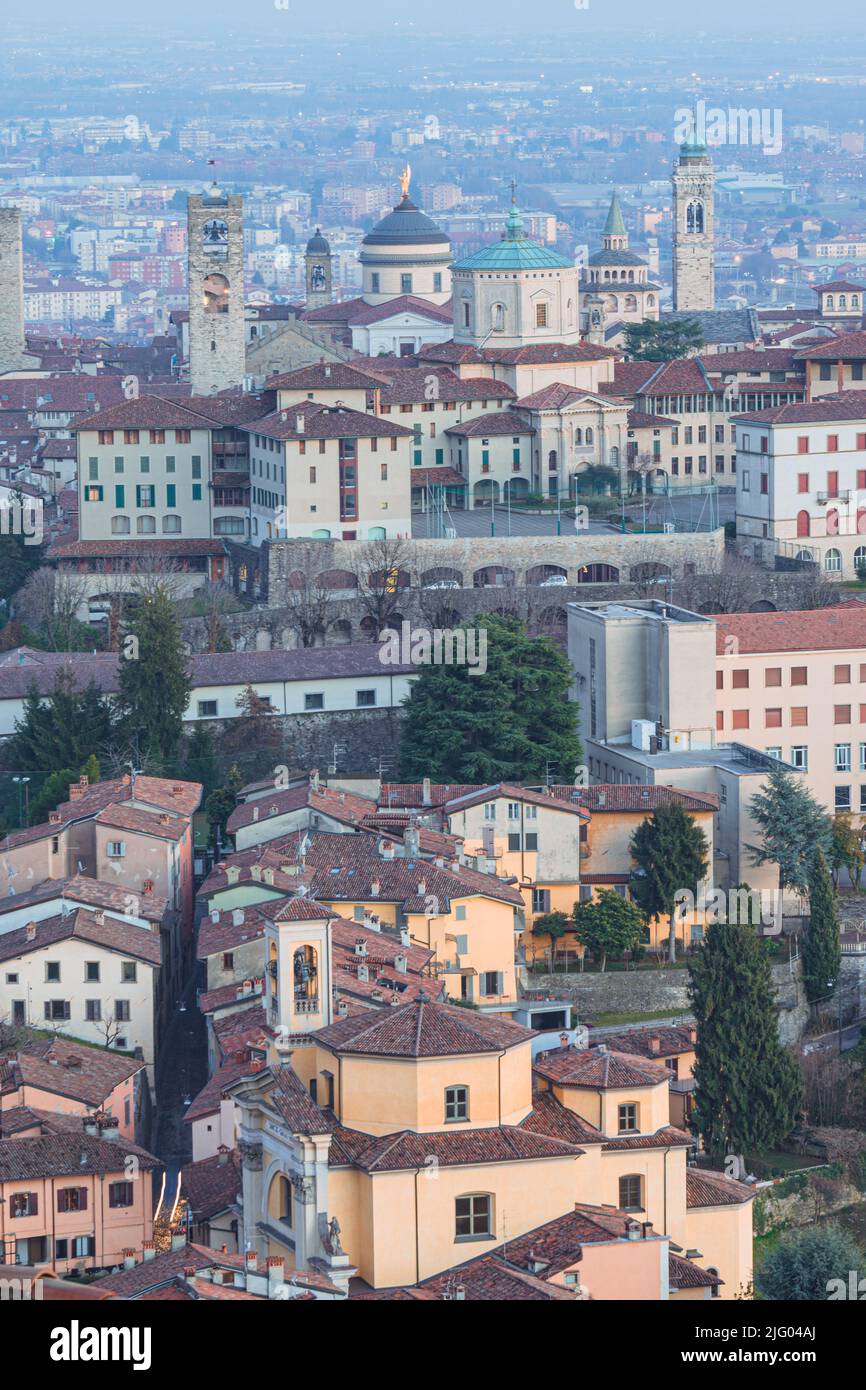 the city of Bergamo, its historic center and the hills, with the lights ...