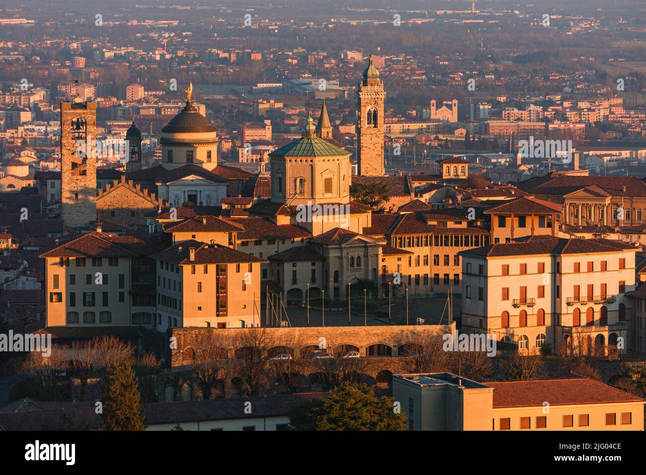 the city of Bergamo, its historic center and the hills, with the lights ...