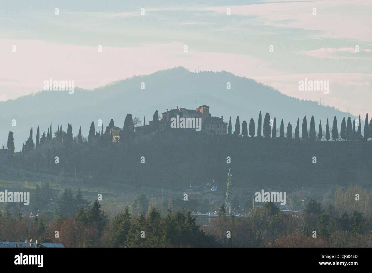 the city of Bergamo, its historic center and the hills, with the lights ...