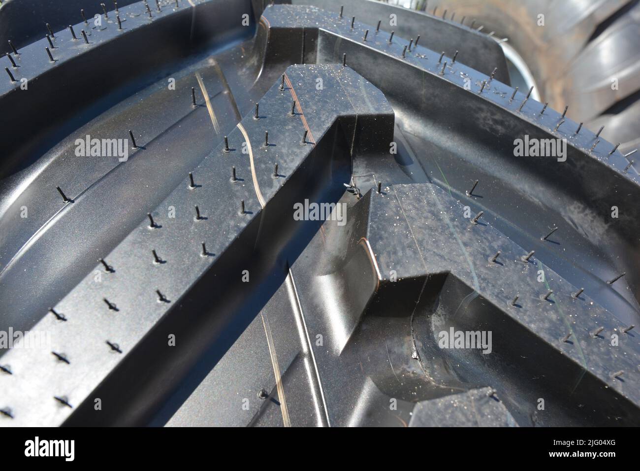 A close up on a tractor tire, agricultural farm tire with big pattern ...
