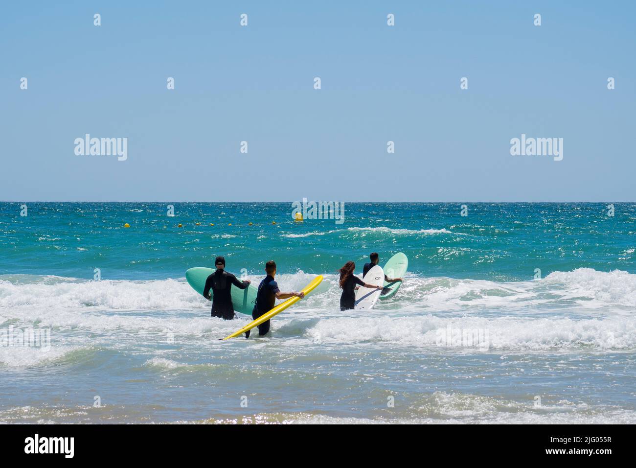 surfers in the water surfing Stock Photo - Alamy
